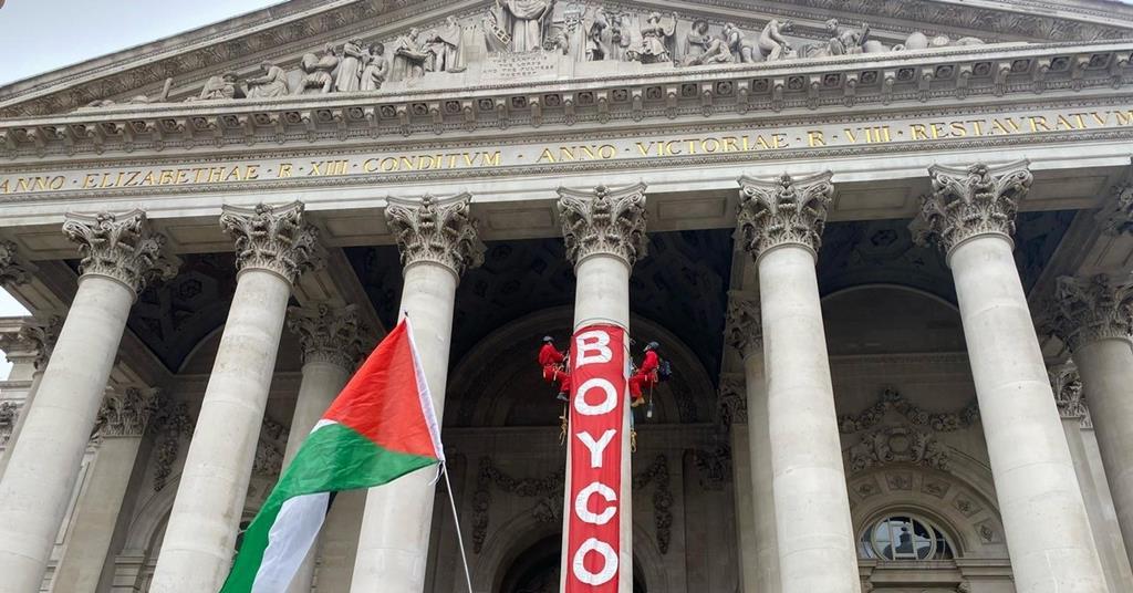Pro-Palestine protesters climb Guardian Royal Exchange in insurance ...