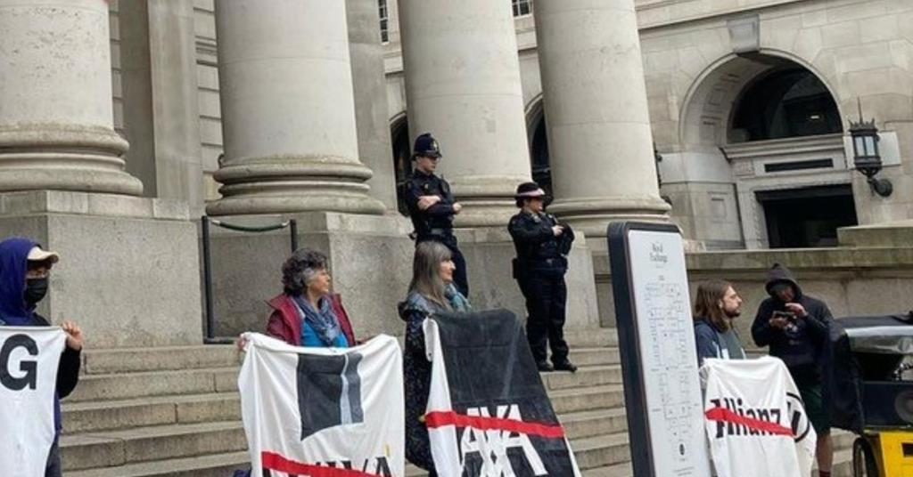 Pro-Palestine protesters climb Guardian Royal Exchange in insurance ...
